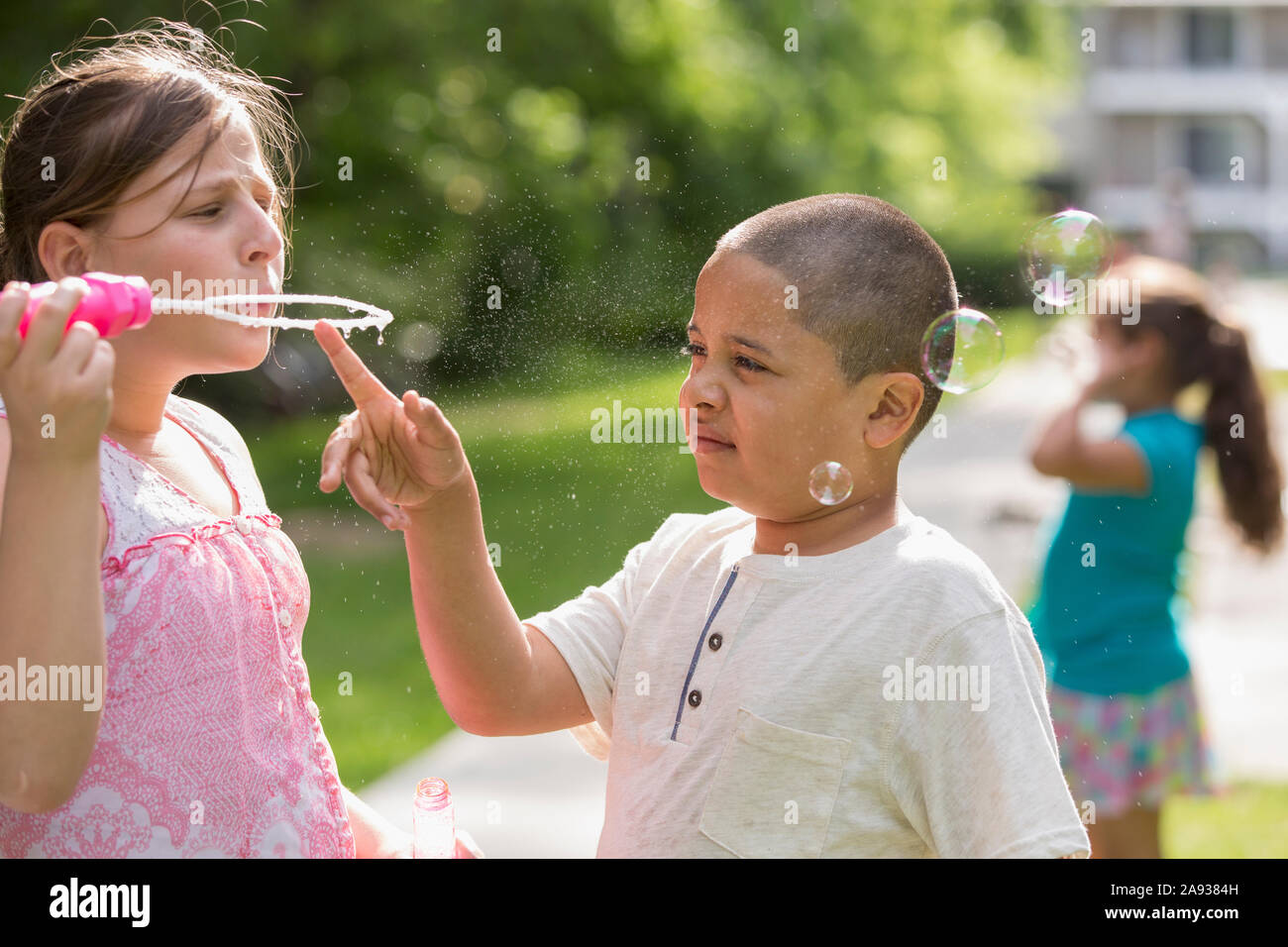 Latin american children playing sunny hi-res stock photography and ...