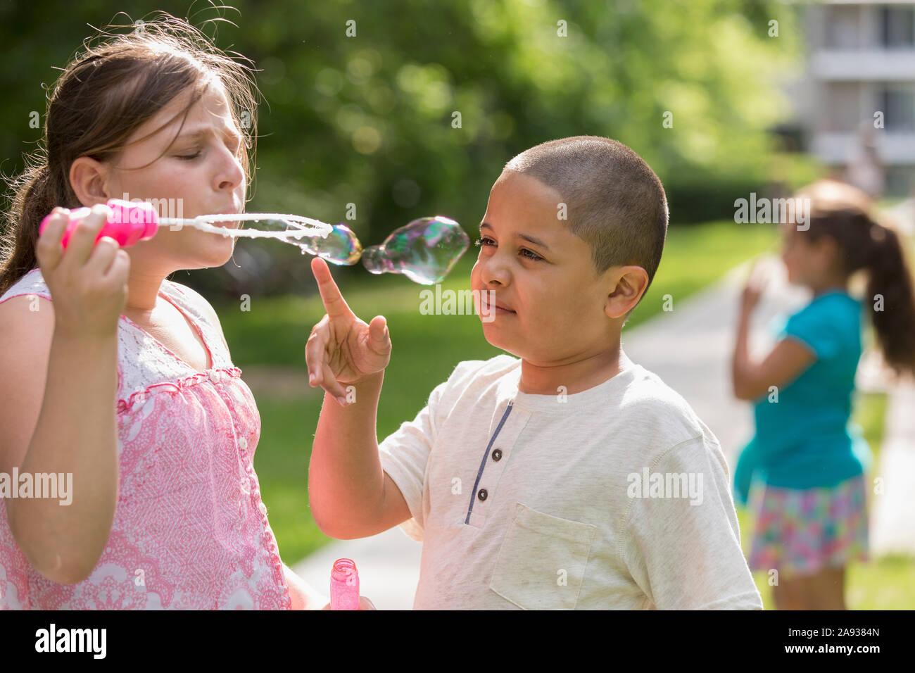 Latin american children playing sunny hi-res stock photography and ...