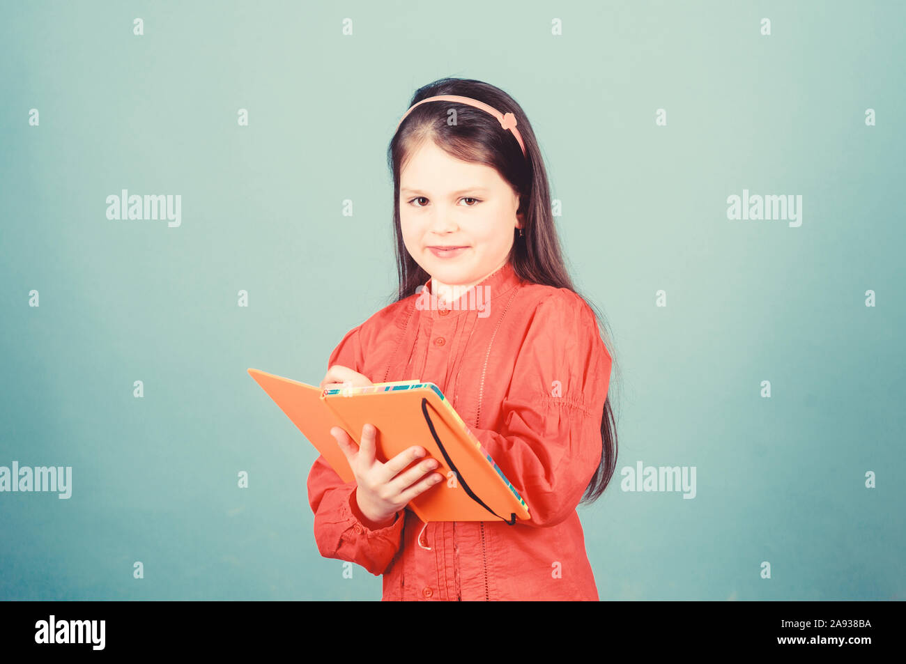 Lets look in the book of scientific knowledge. Cute little child ...