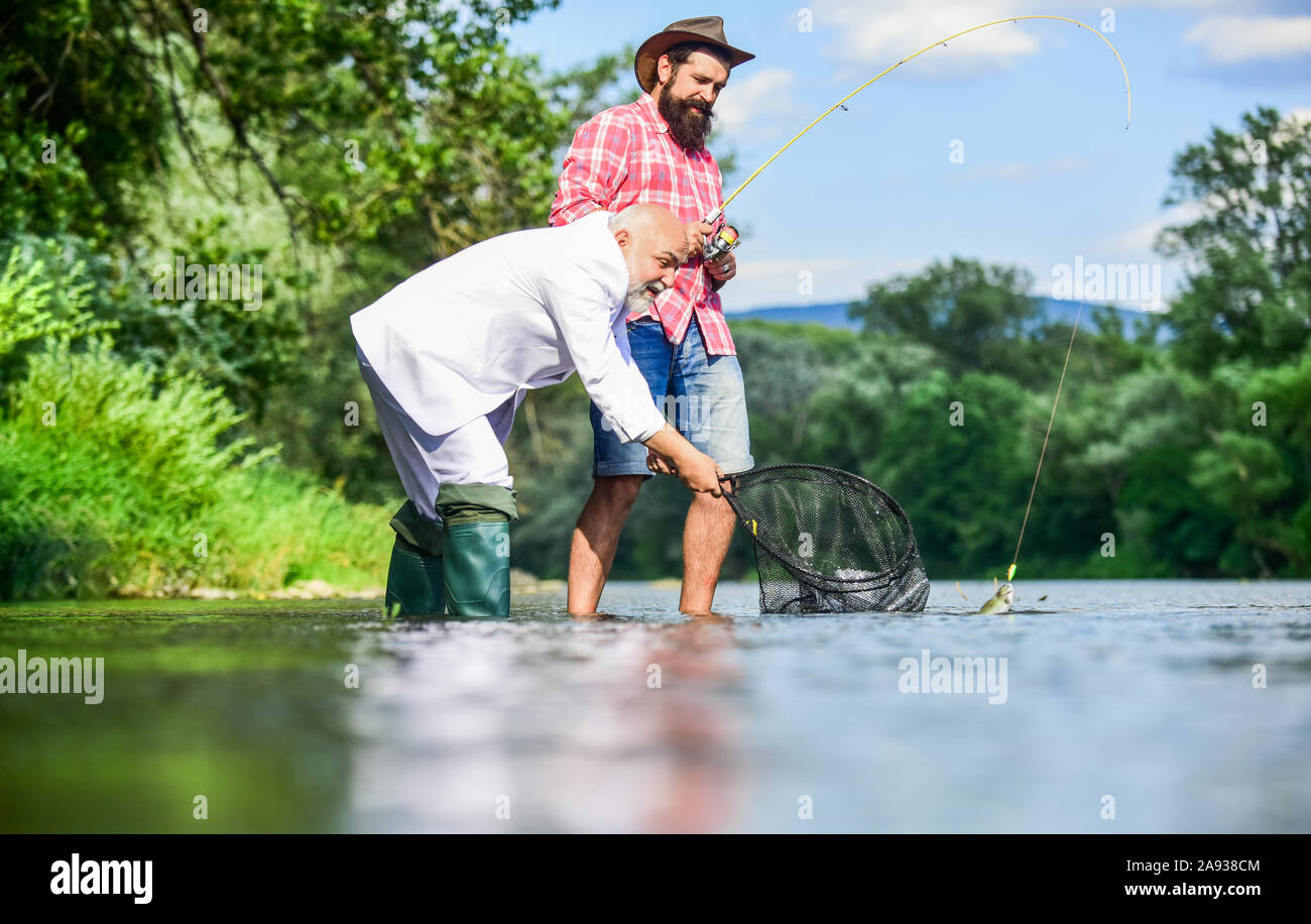 Happy family concept. Catching and fishing concept. Two male friends ...