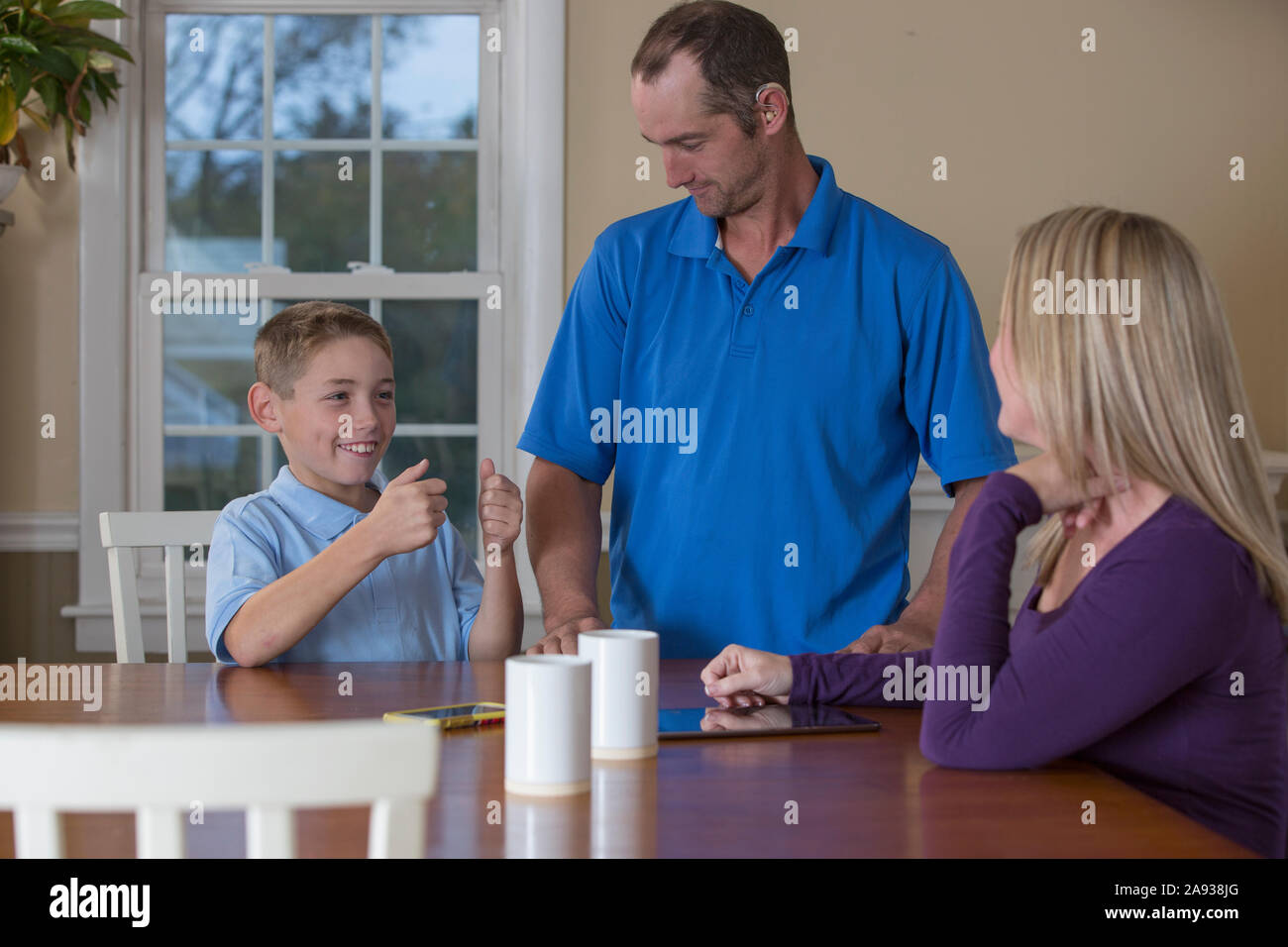 Son saying 'Video games' in American Sign Language to his parents at ...
