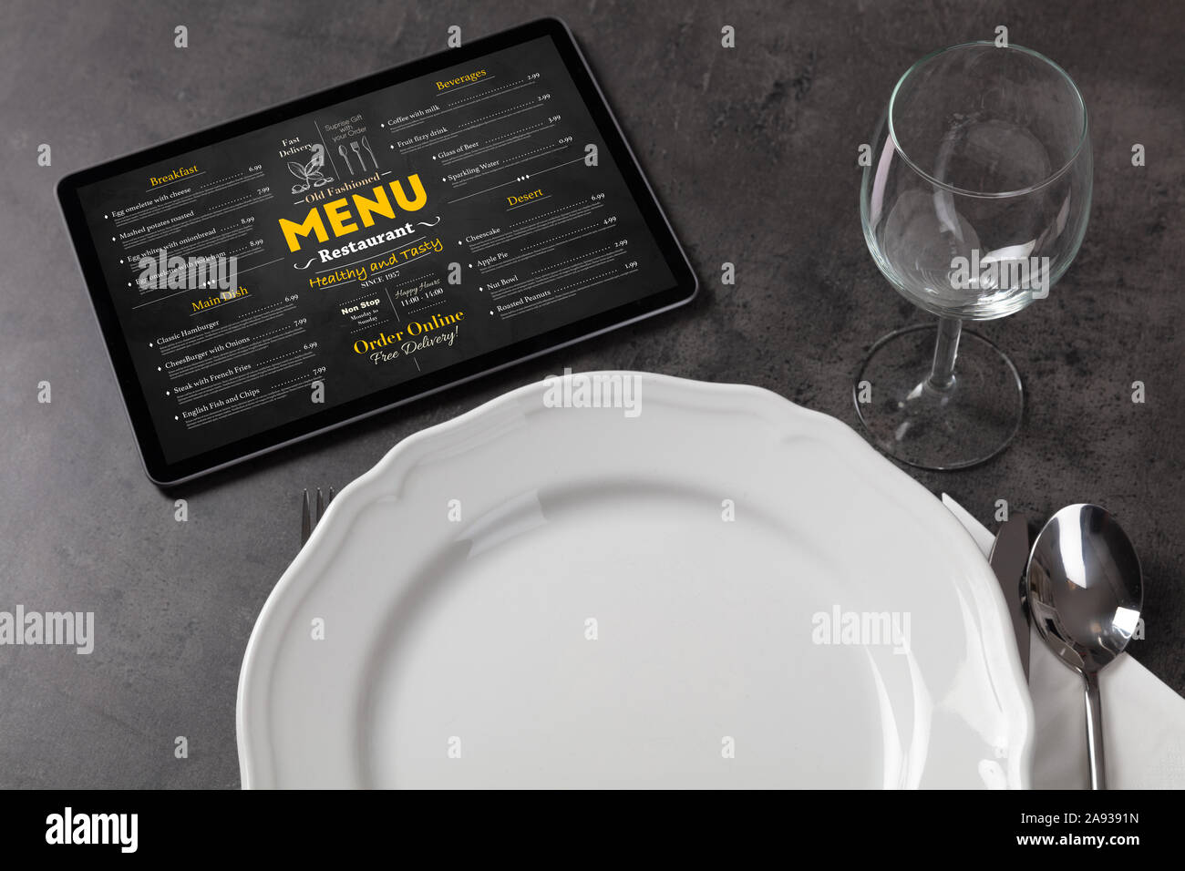 Empty plate and tableware with online order menu Stock Photo - Alamy