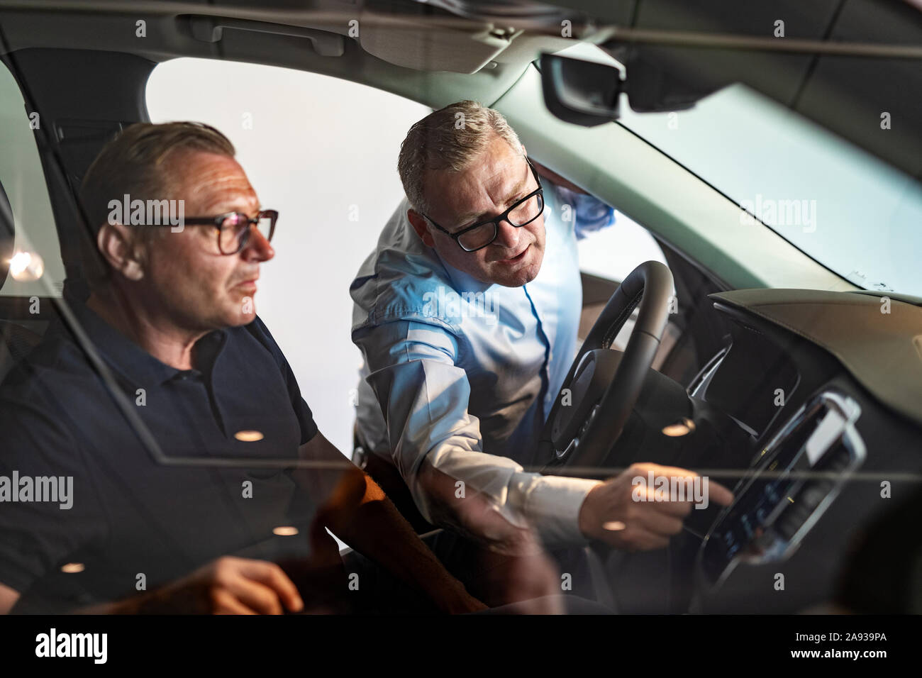 Men in car Stock Photo - Alamy