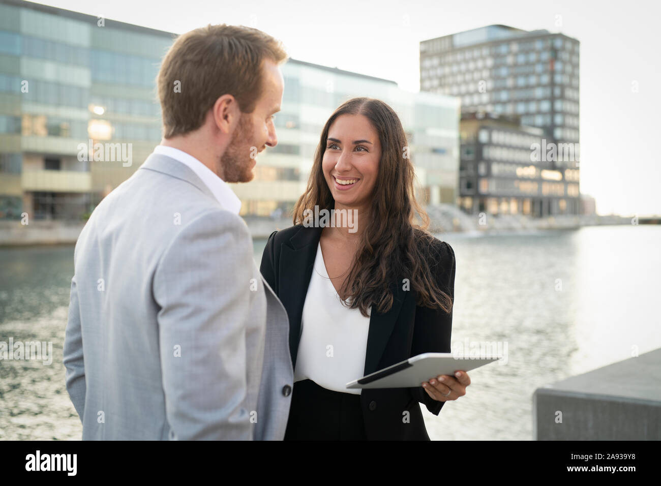 Business people talking outside Stock Photo - Alamy