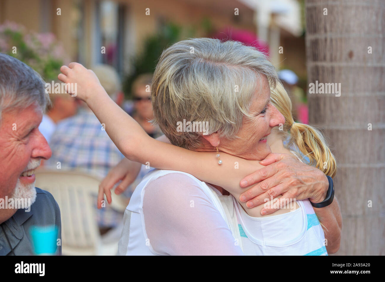 Child hugging grandparent hi-res stock photography and images - Alamy