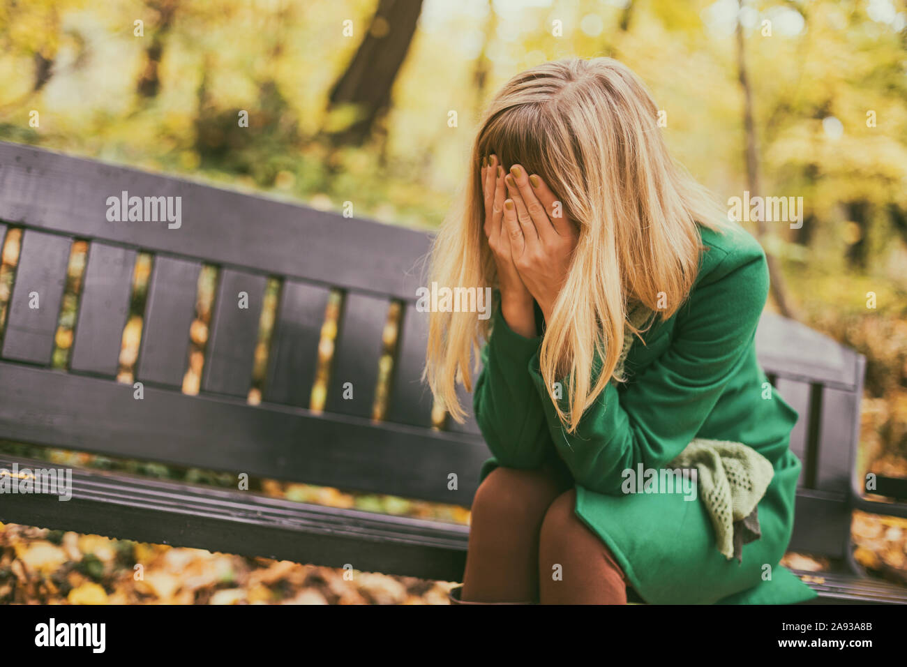 Woman crying in park hi-res stock photography and images - Alamy