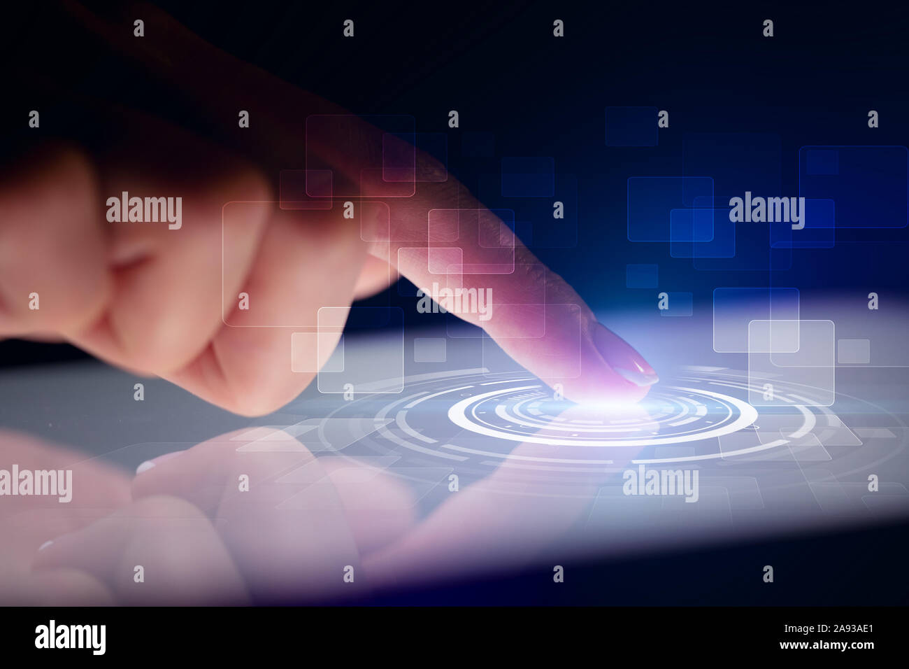 Finger touching tablet with identification concept and dark background ...