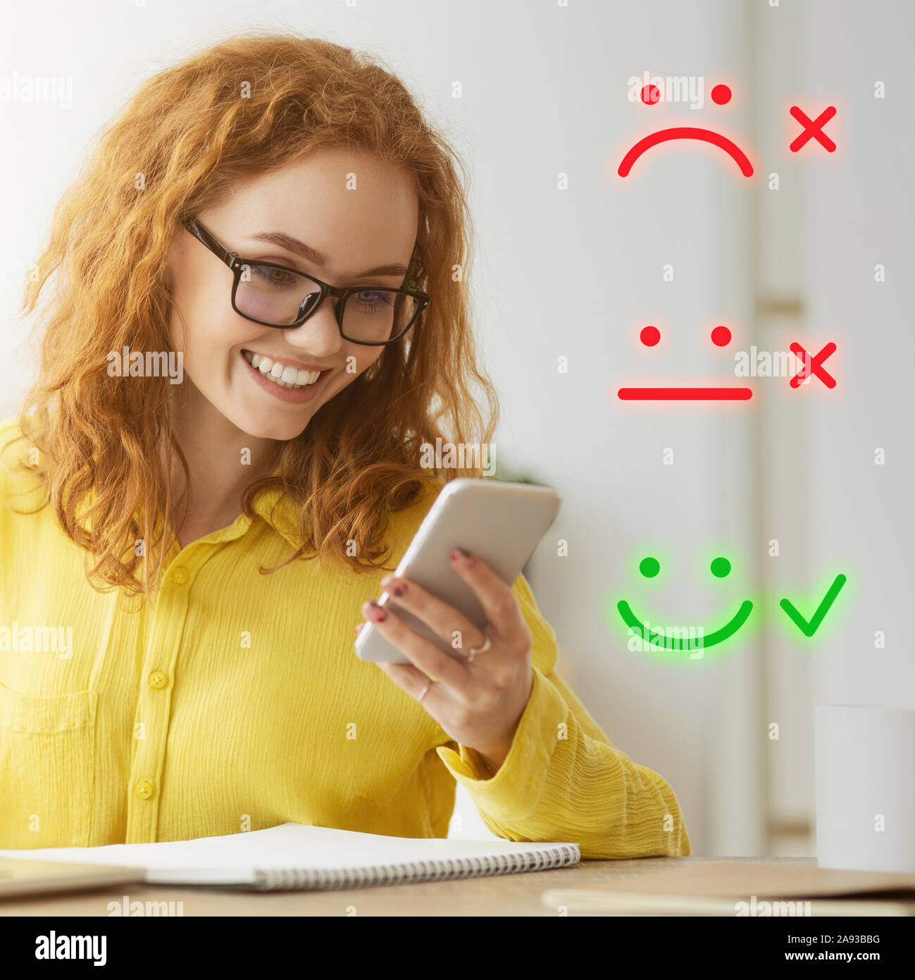 Red-haired woman giving high marks for service Stock Photo - Alamy