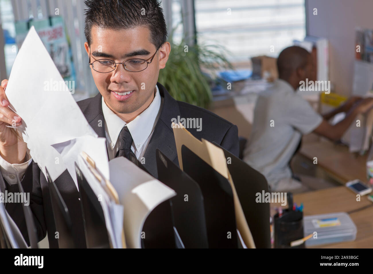 Two men with Autism working in an office Stock Photo - Alamy