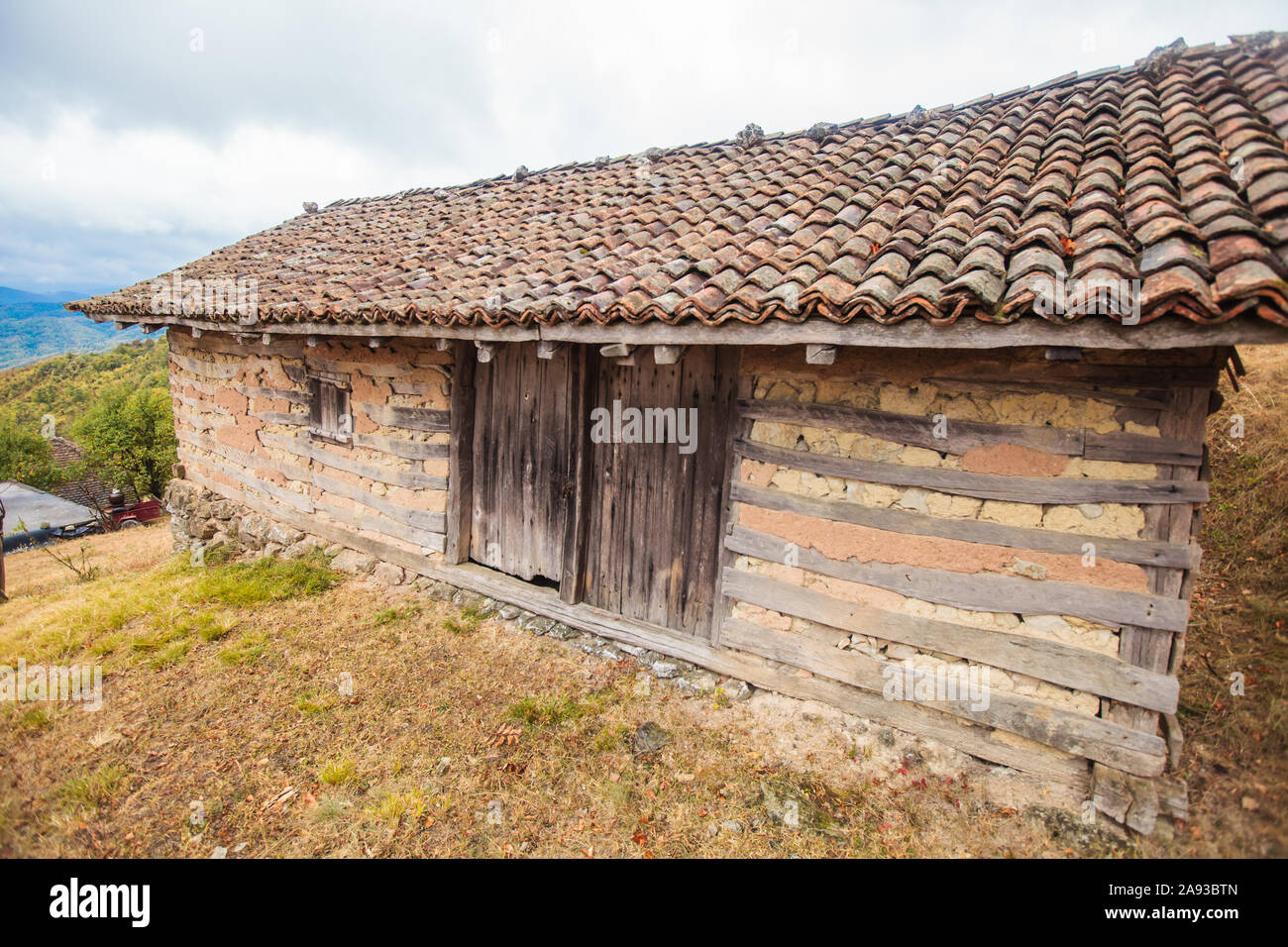 Rural landscape, wooden house in small village Stock Photo - Alamy