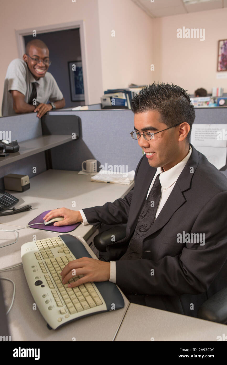 Two men with Autism working on computer in an office Stock Photo - Alamy
