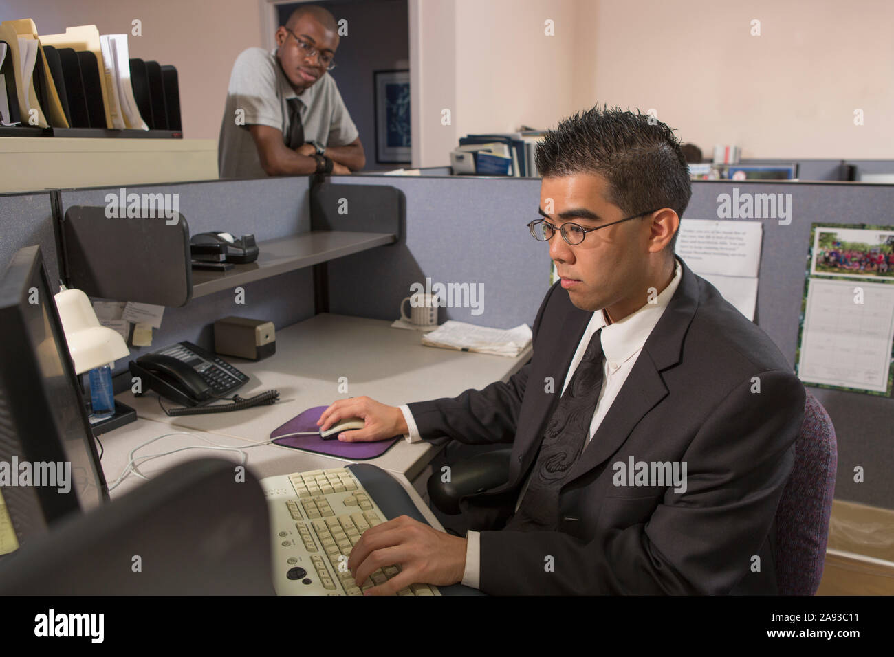 Two men with Autism working on computer in an office Stock Photo - Alamy