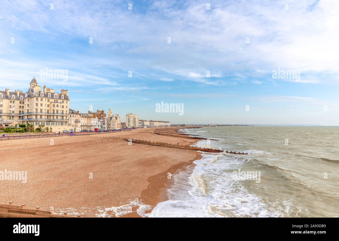 Panorama of the beach and front at Eastbourne. Breakwaters lead down to ...