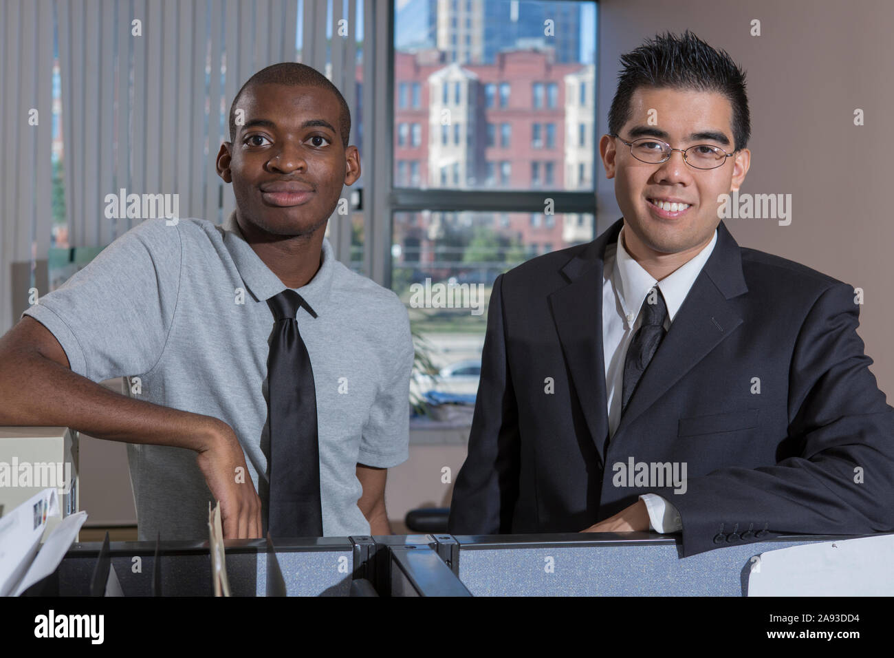 Portrait of two men with Autism smiling in an office Stock Photo - Alamy
