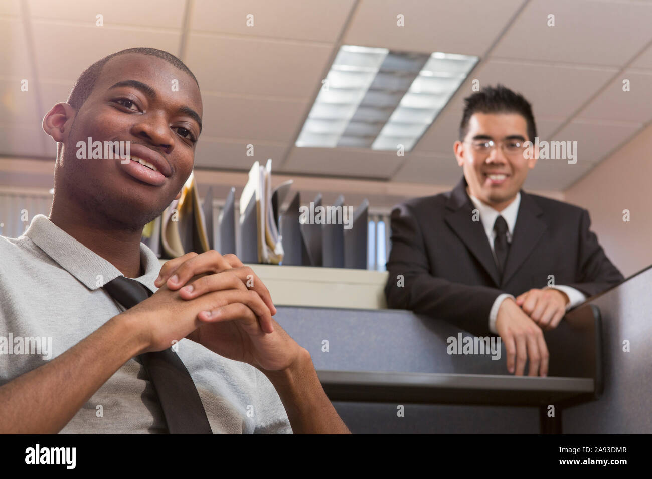 Portrait of two men with Autism smiling in an office Stock Photo - Alamy