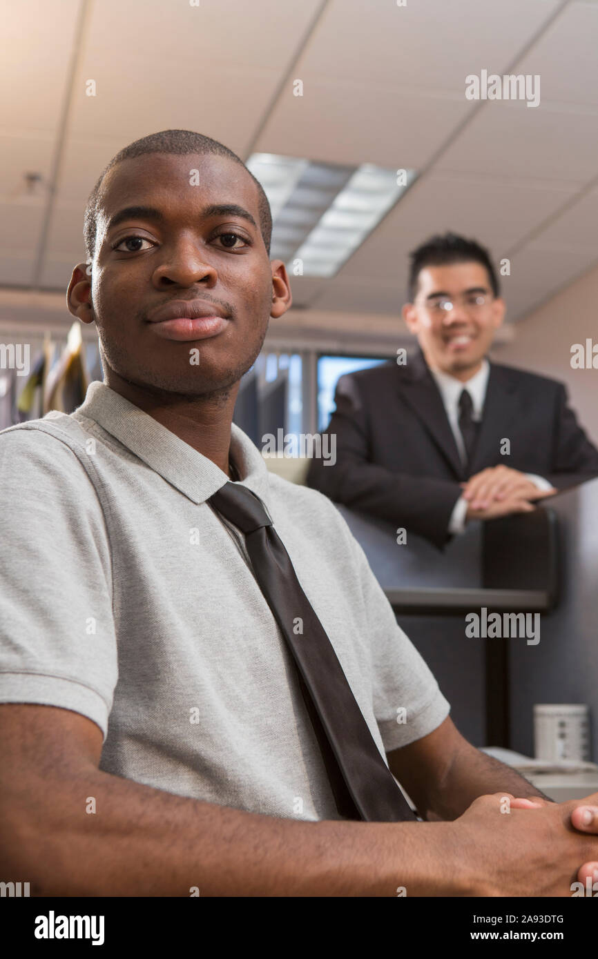 Portrait of two men with Autism working in an office Stock Photo - Alamy