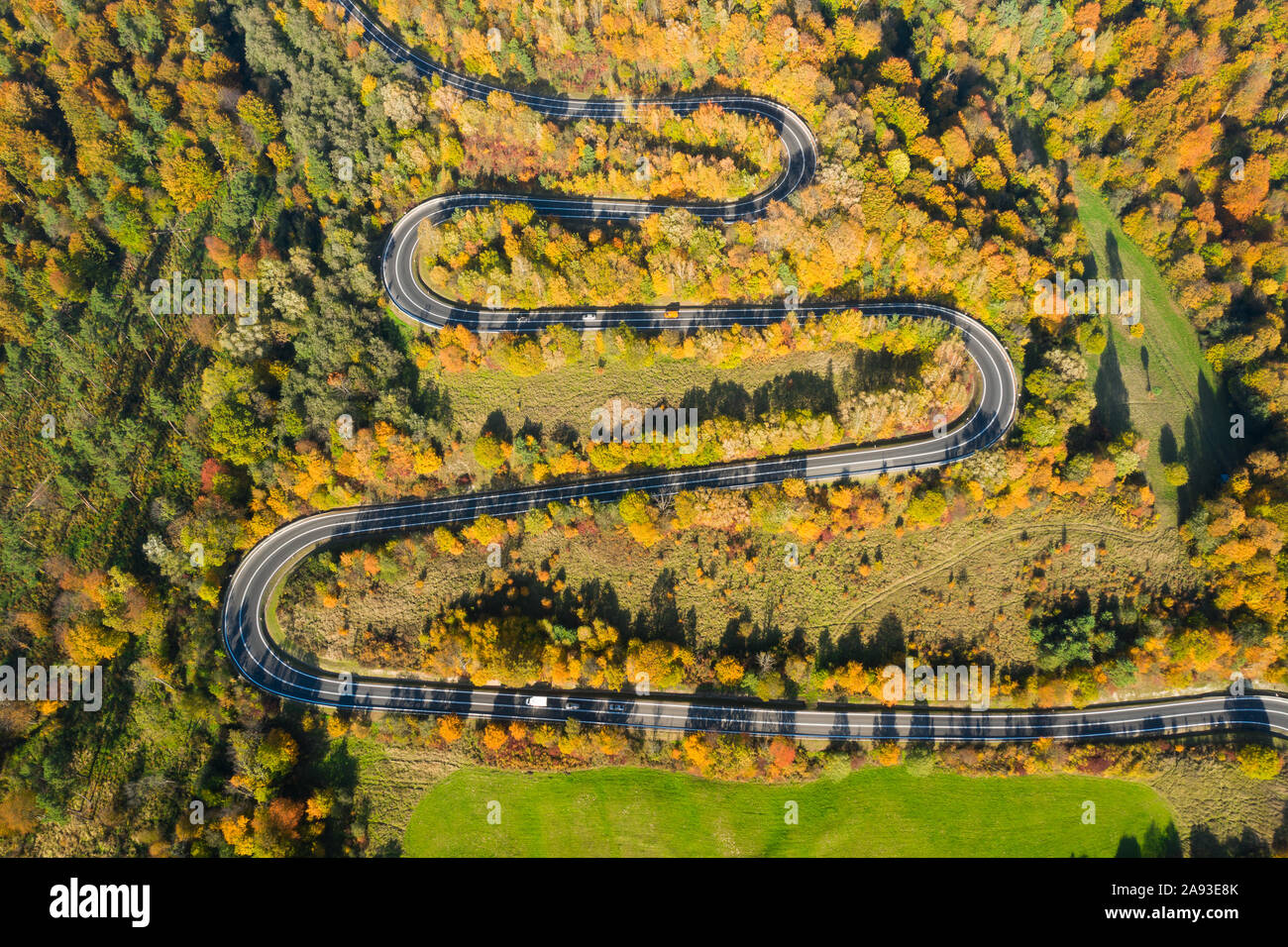 Drone view - Aerial view of autumn forest road. Top view of beautiful ...