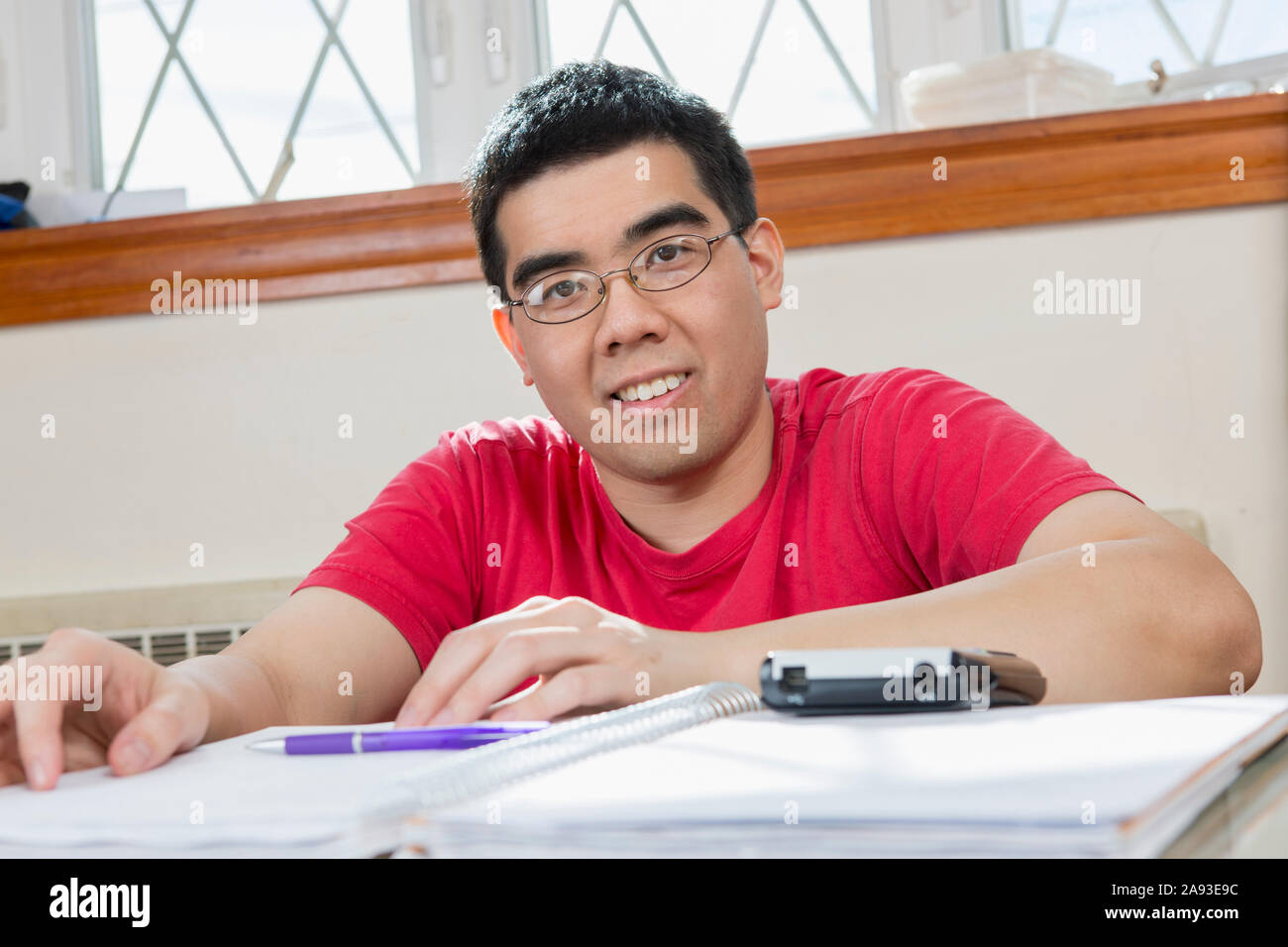 Portrait of Asian man with Autism working in his home Stock Photo - Alamy