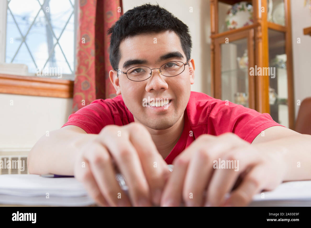 Portrait of happy Asian man with Autism working in his home Stock Photo ...