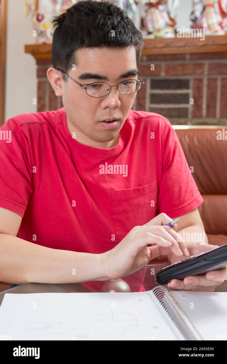 Asian man with Autism working on his cell phone Stock Photo - Alamy