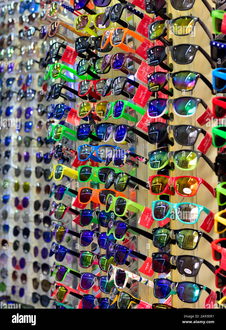 Colourful display of mass of coloured sunglasses Stock Photo - Alamy