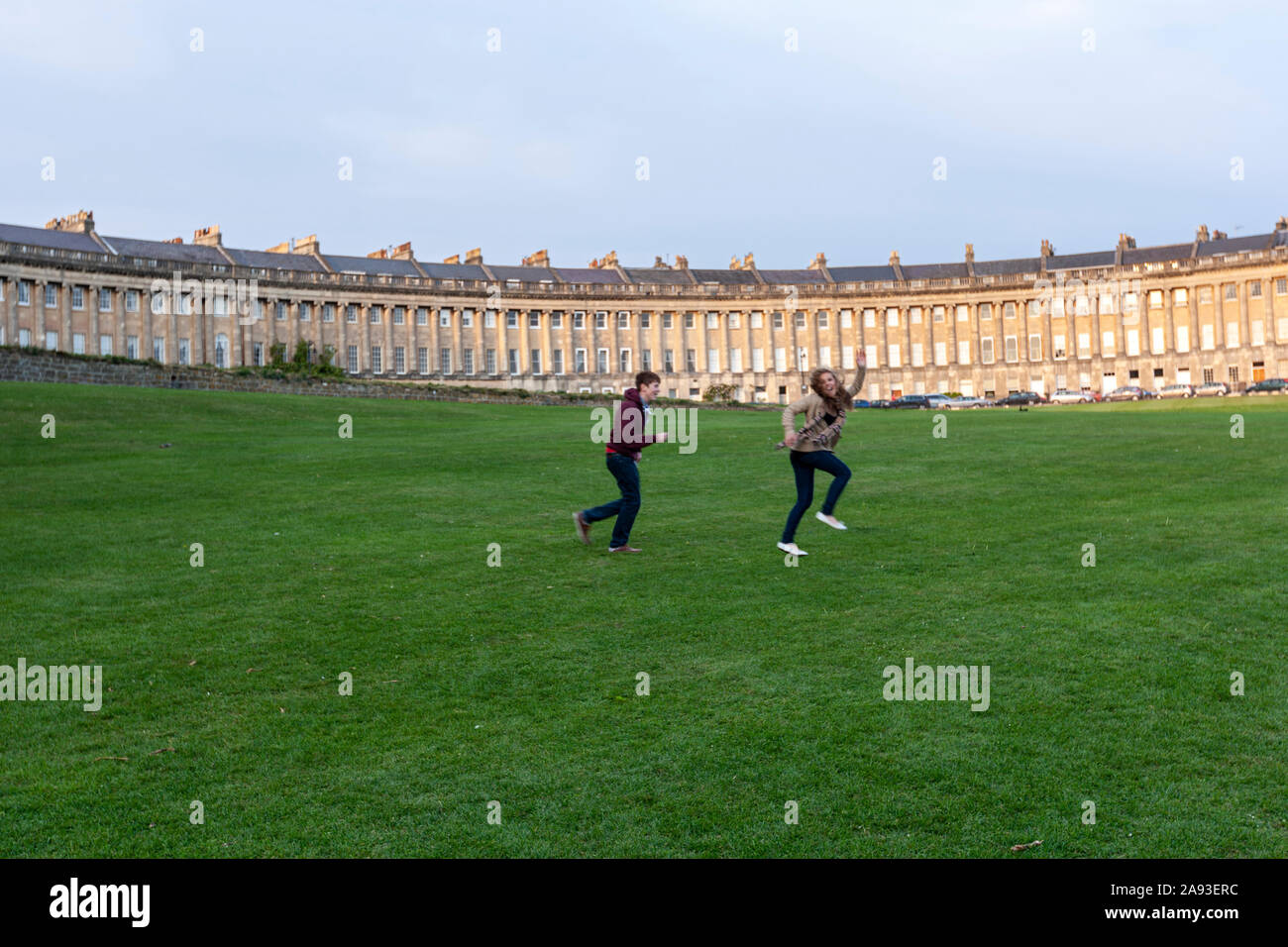Young people dancing in park, Royal Crescent, a row of 30 terraced ...