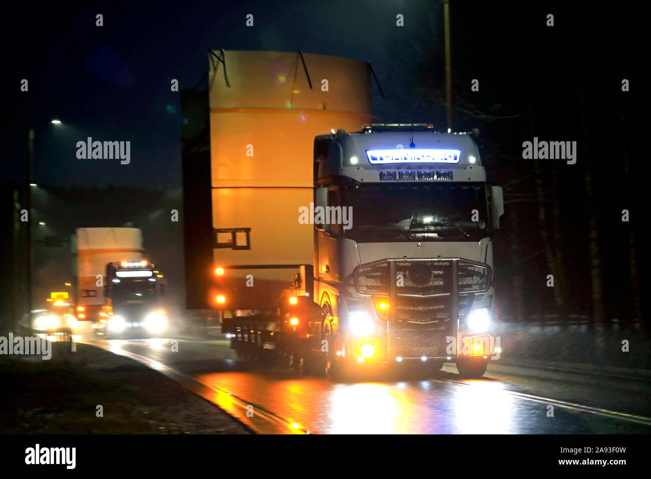 Convoy of two oversize load transports of a 5,5 m high steel frame with ...