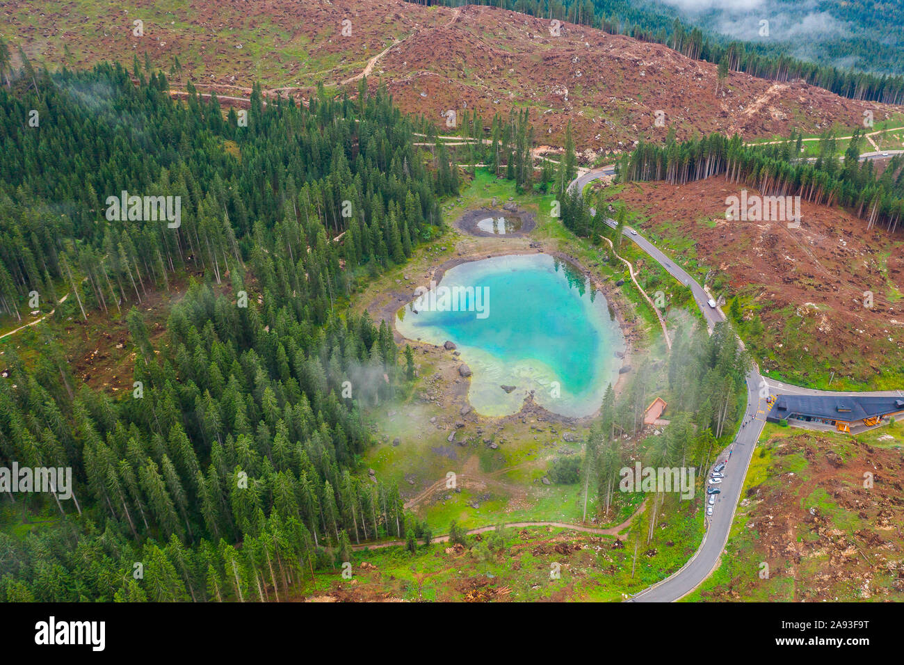 Aerial view of turquoise blue water of lake Carezza in Alps Dolomites ...