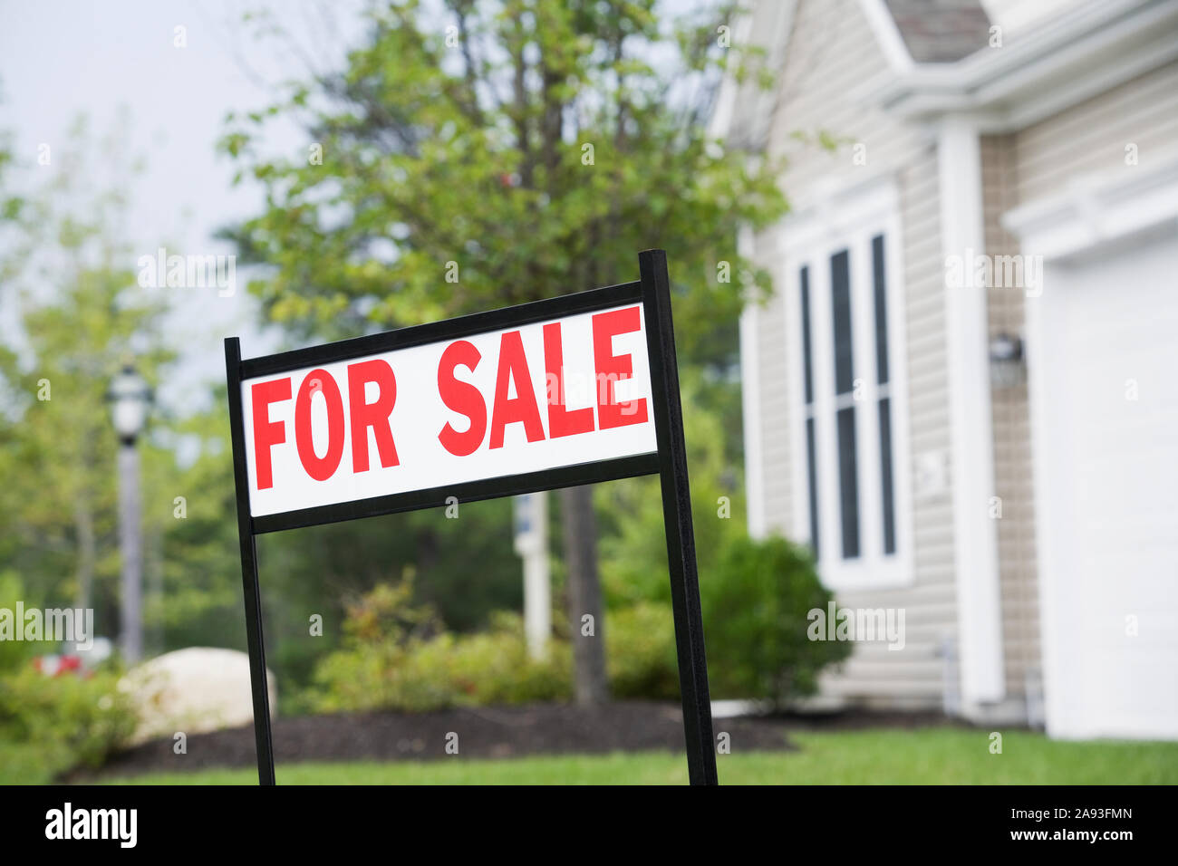 For Sale signboard in front of a house Stock Photo - Alamy