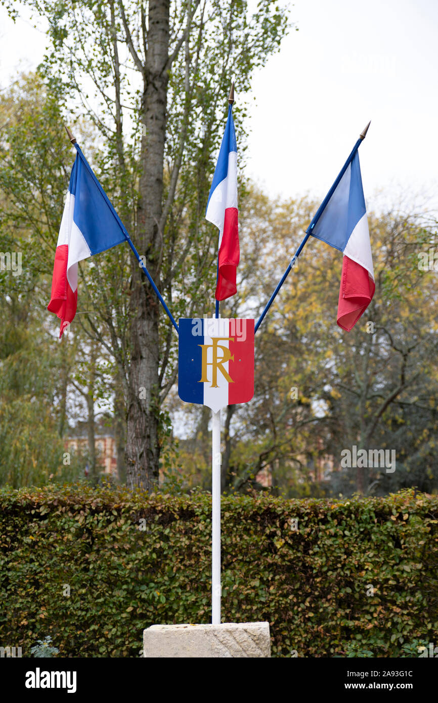 French flag in front of a French crest with "RF" written on it (French ...