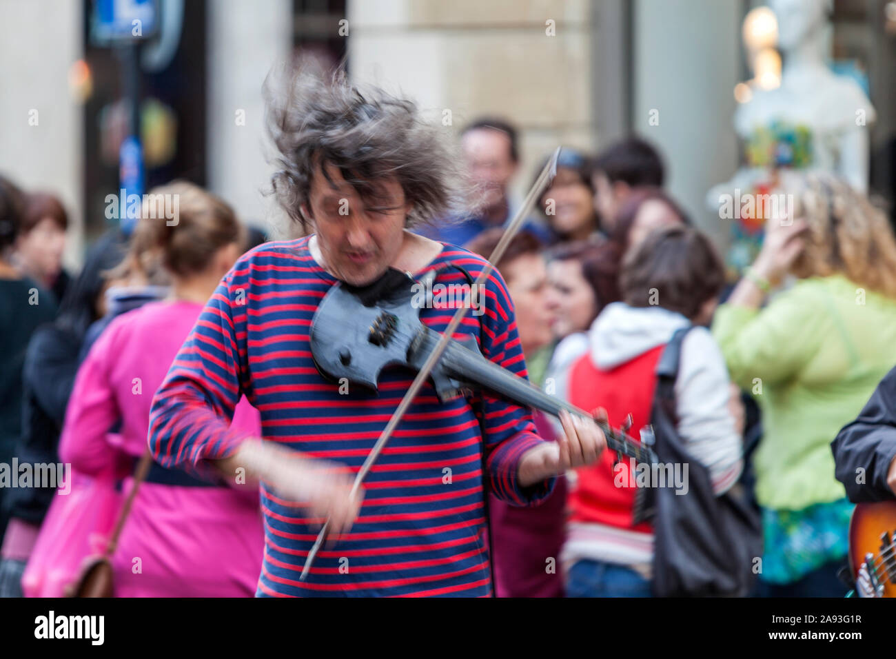 Fiddle player in a Street group busker in Bath, Somerset, England, UK ...