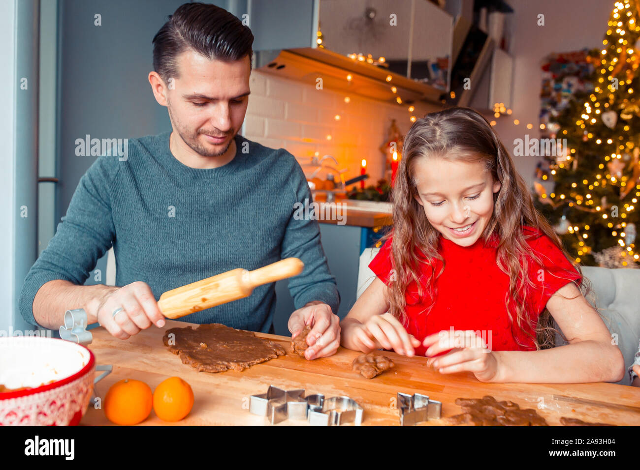 Family preparation holiday food. Father and daughter cooking Christmas ...