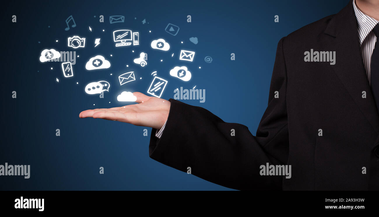 Hand holding application icons and symbols in her hand Stock Photo - Alamy