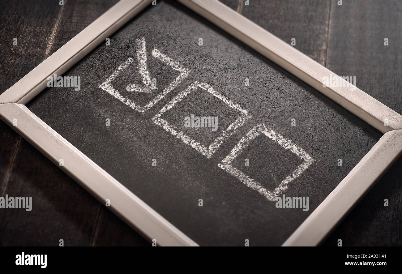 Blackboard with check boxes on chalk board. Hand writing. Dark ...