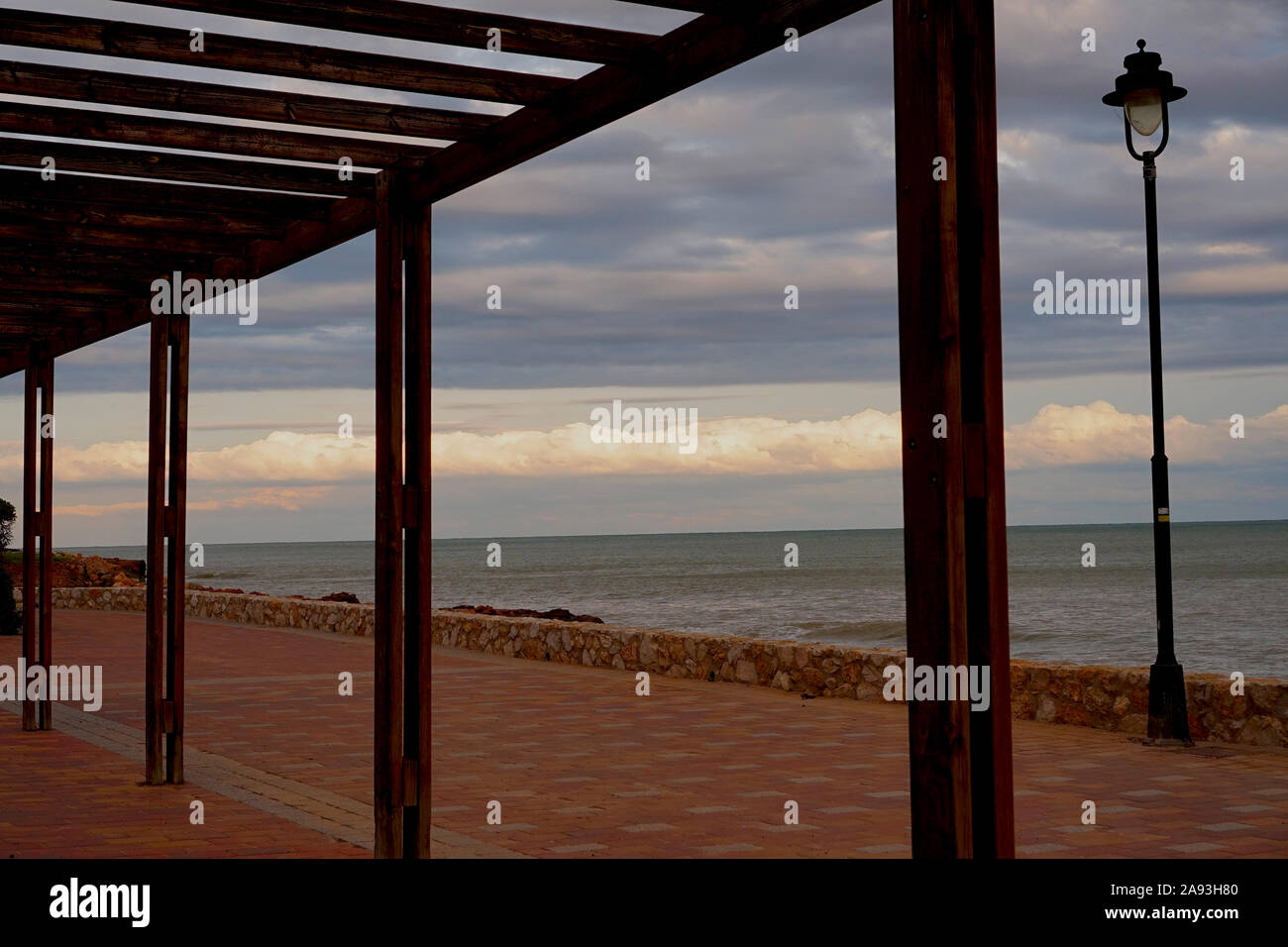 Outdoor communal wooden pergola passageway with a seaside view Stock ...