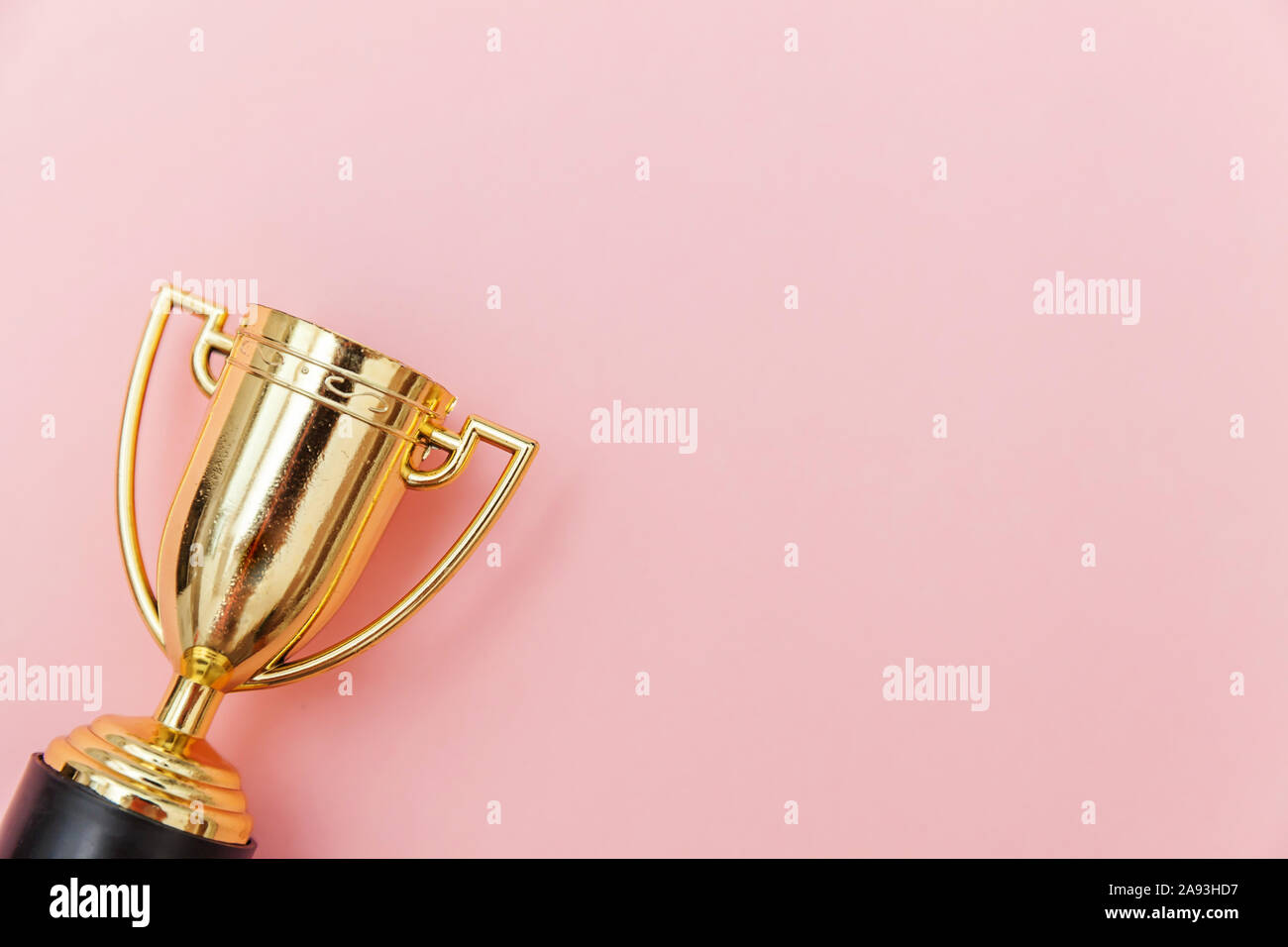 Simply flat lay design winner or champion gold trophy cup isolated on ...