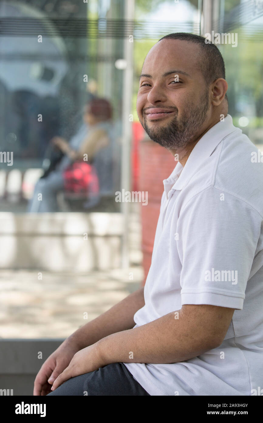 Man sitting waiting for a bus hi-res stock photography and images - Alamy