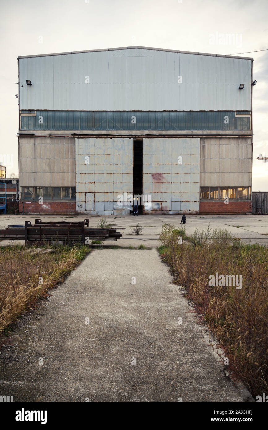 large industrial metal door from an abandoned factory Stock Photo - Alamy