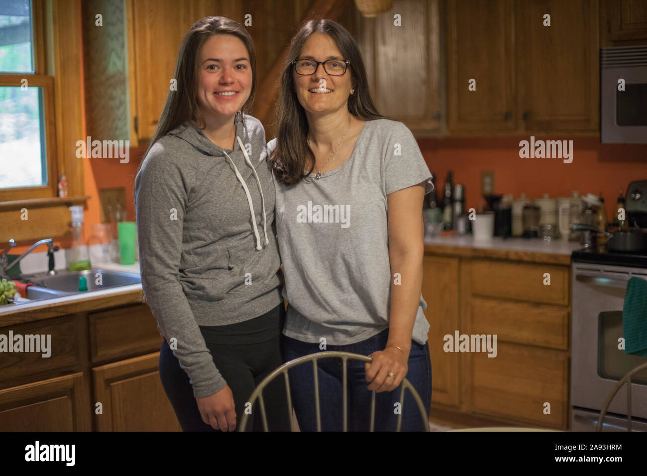 Disabled mother and daughter in kitchen hi-res stock photography and ...