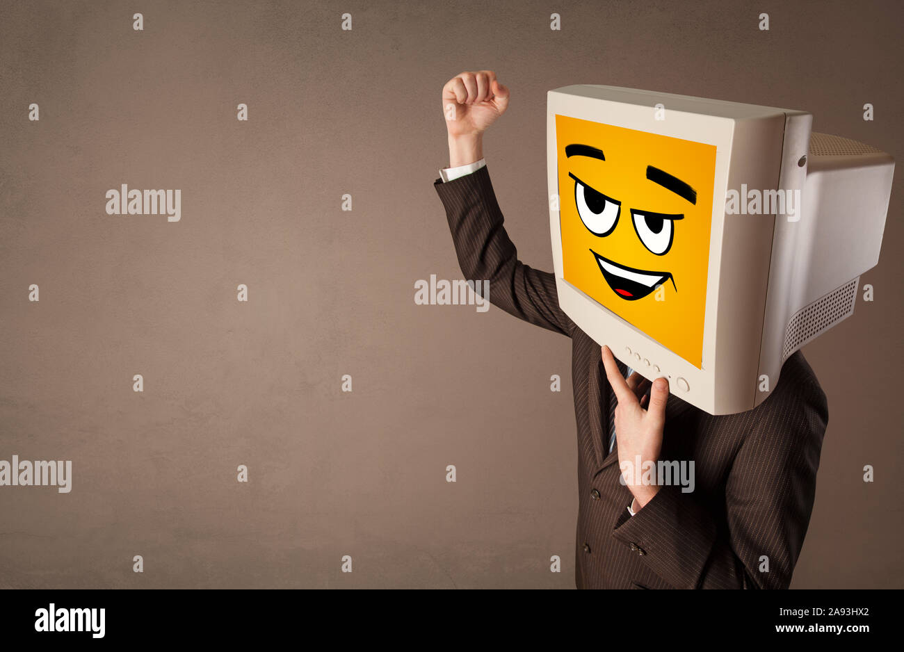 Young person with happy smiley monitor head Stock Photo - Alamy