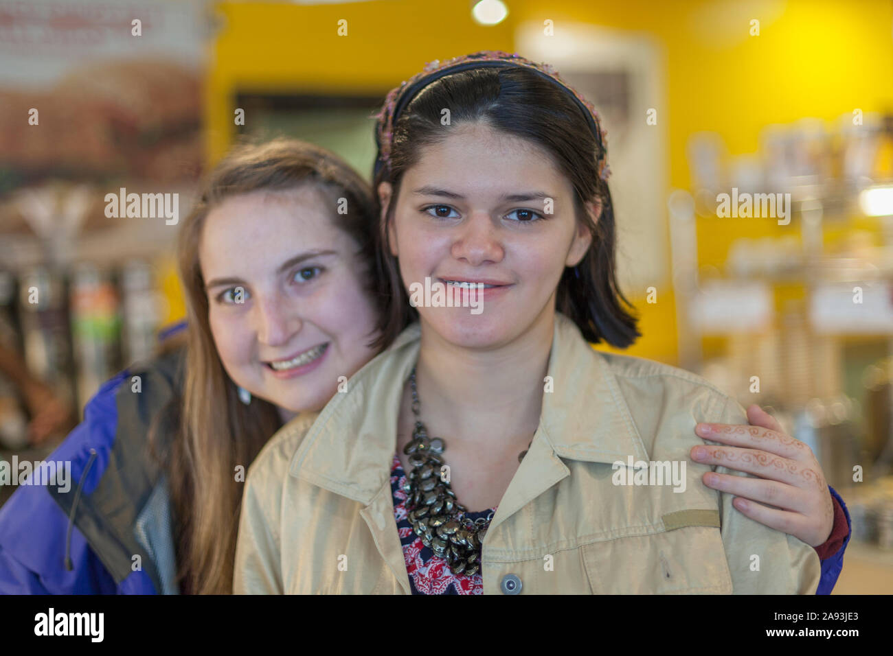 Two female friends hanging out together, one with Cerebral Palsy and ...