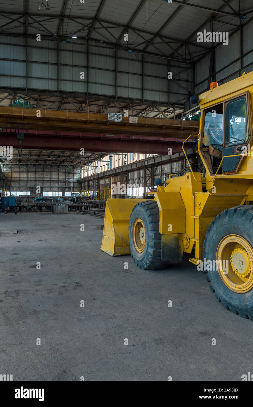 bulldozer in a large industrial building, close up Stock Photo - Alamy