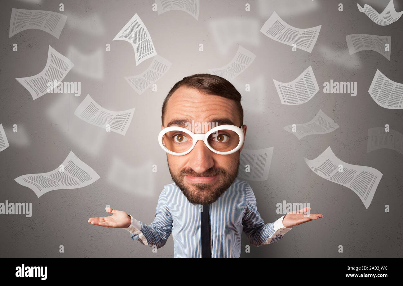 Big head on small body with flying documents around Stock Photo - Alamy