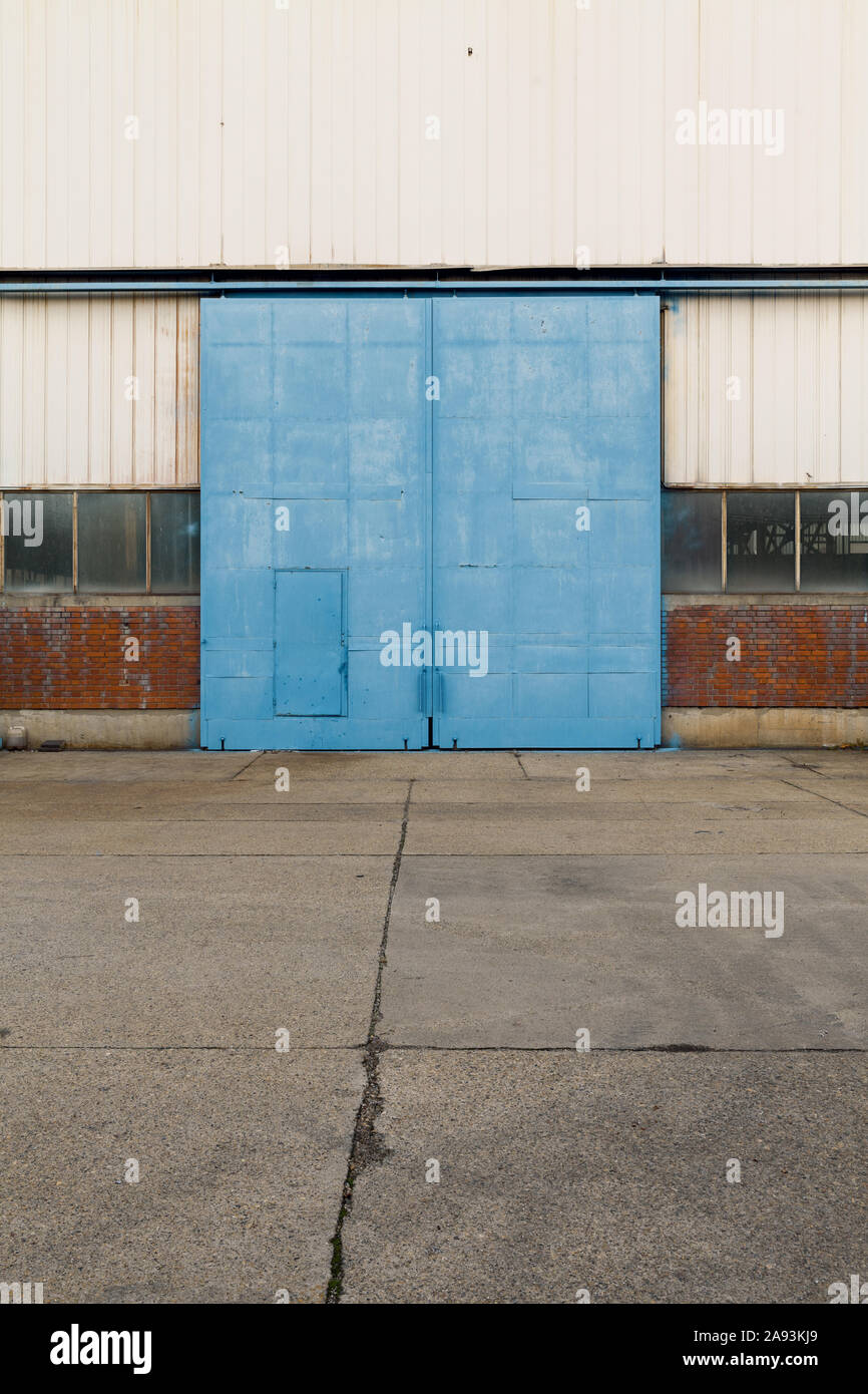 large industrial metal door from an abandoned factory Stock Photo - Alamy