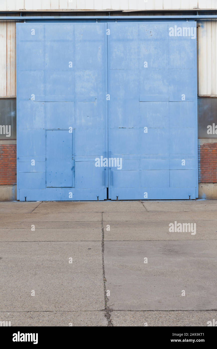 large industrial metal door from an abandoned factory Stock Photo - Alamy