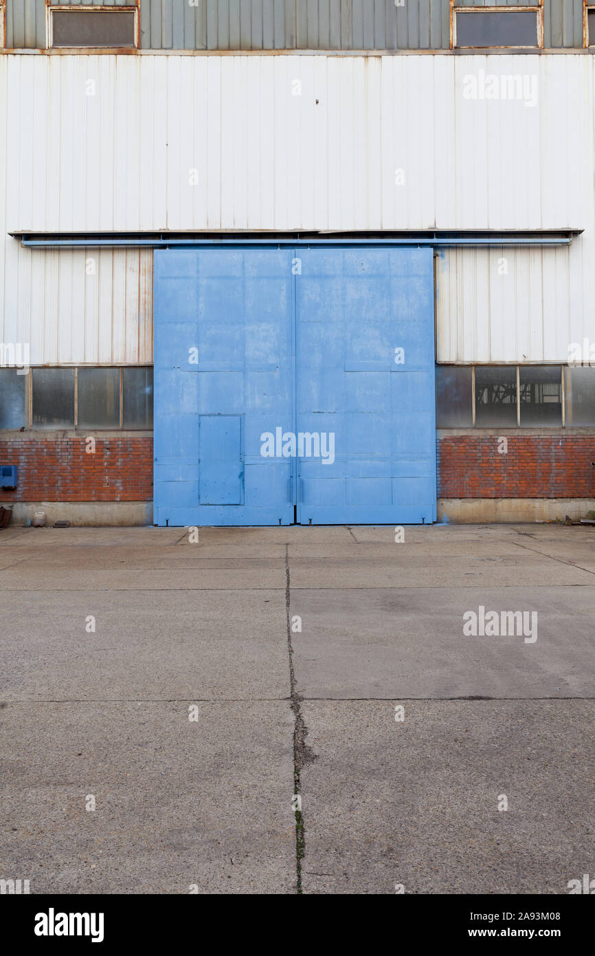 large industrial metal door from an abandoned factory Stock Photo - Alamy