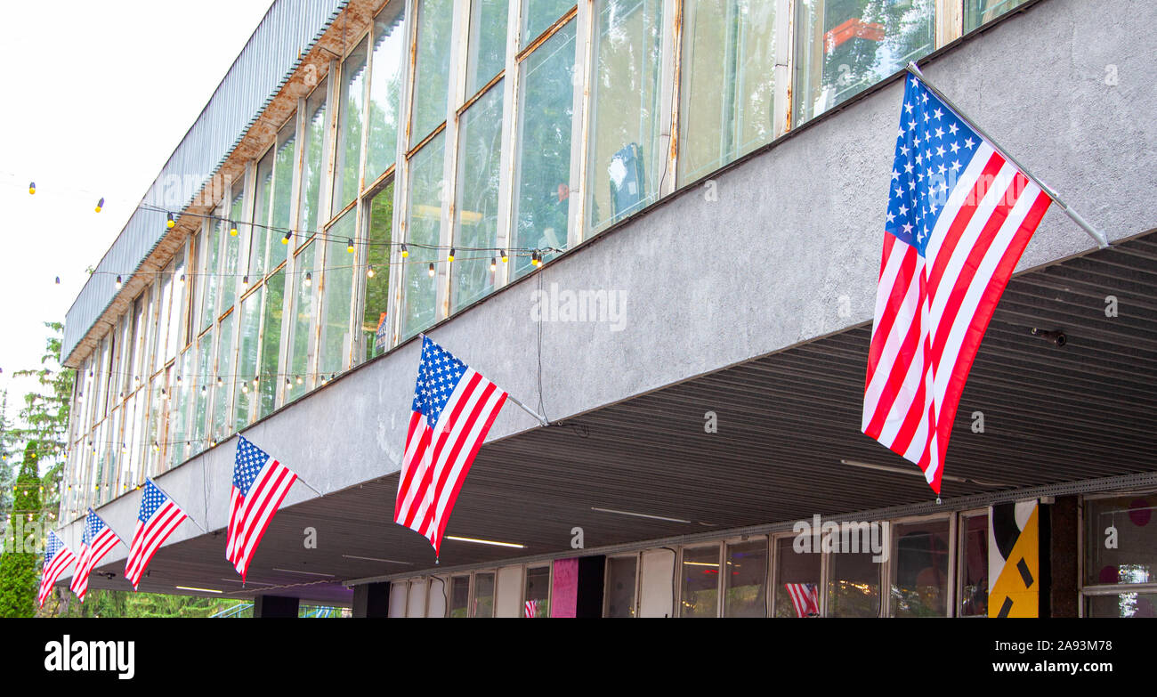 Flags of America on a building. USA flag. Independence Day Stock Photo ...