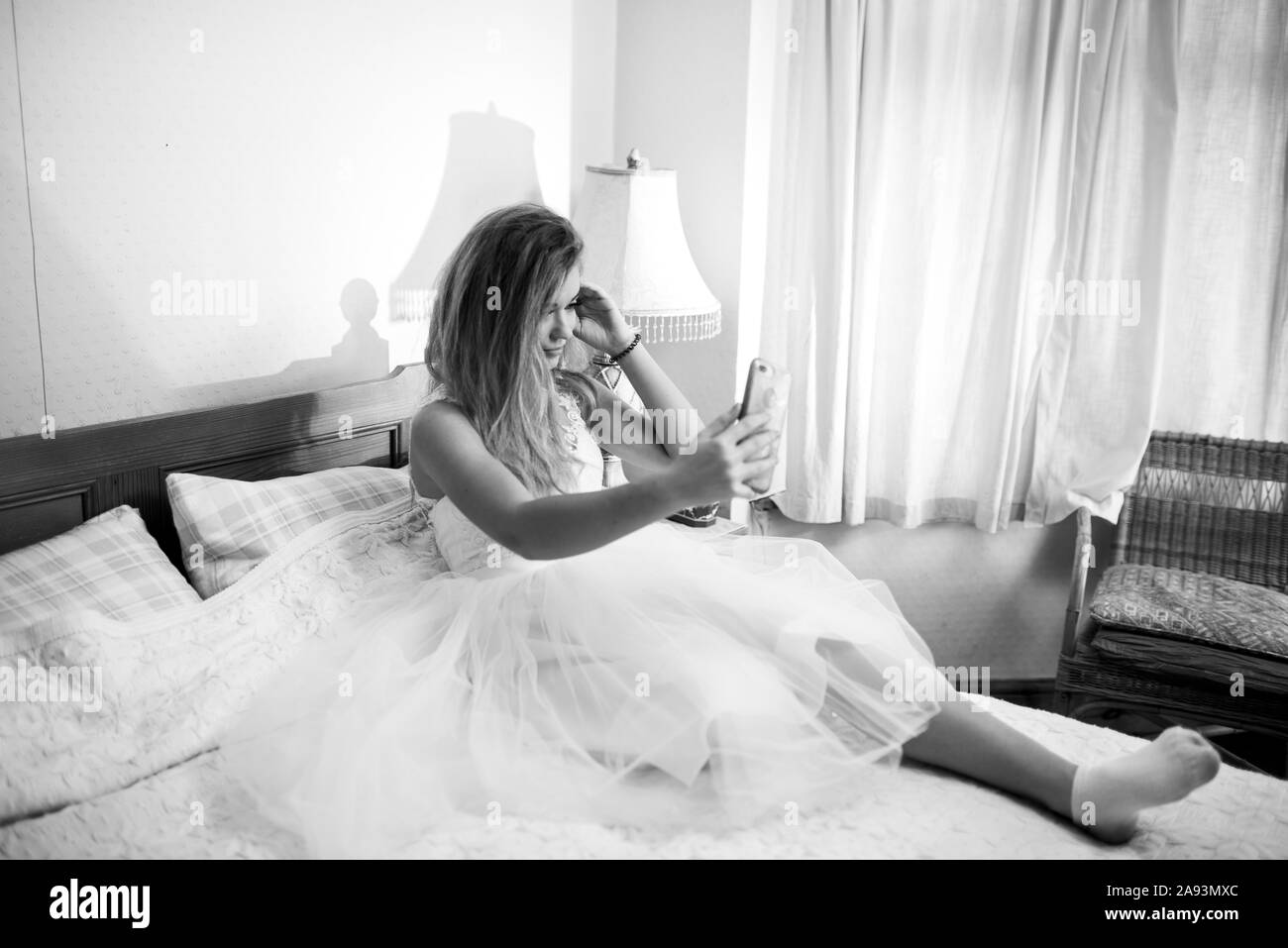 Young bride gets ready - morning sun and wedding day morning Stock ...