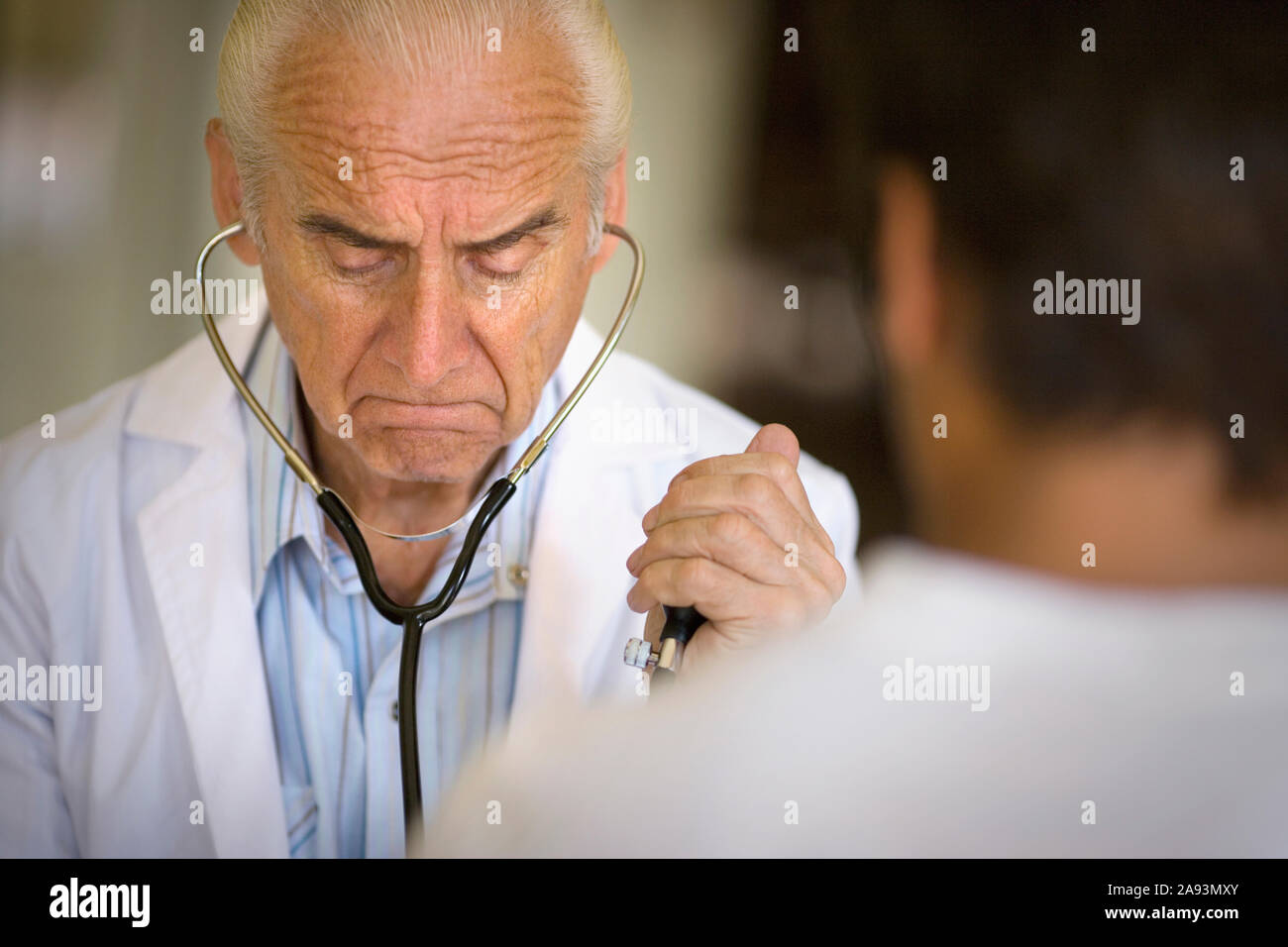View of a doctor checking up a patient Stock Photo - Alamy