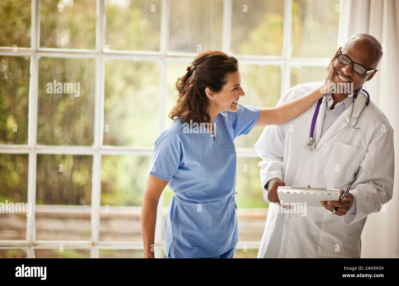 Female doctor laughing hi-res stock photography and images - Alamy